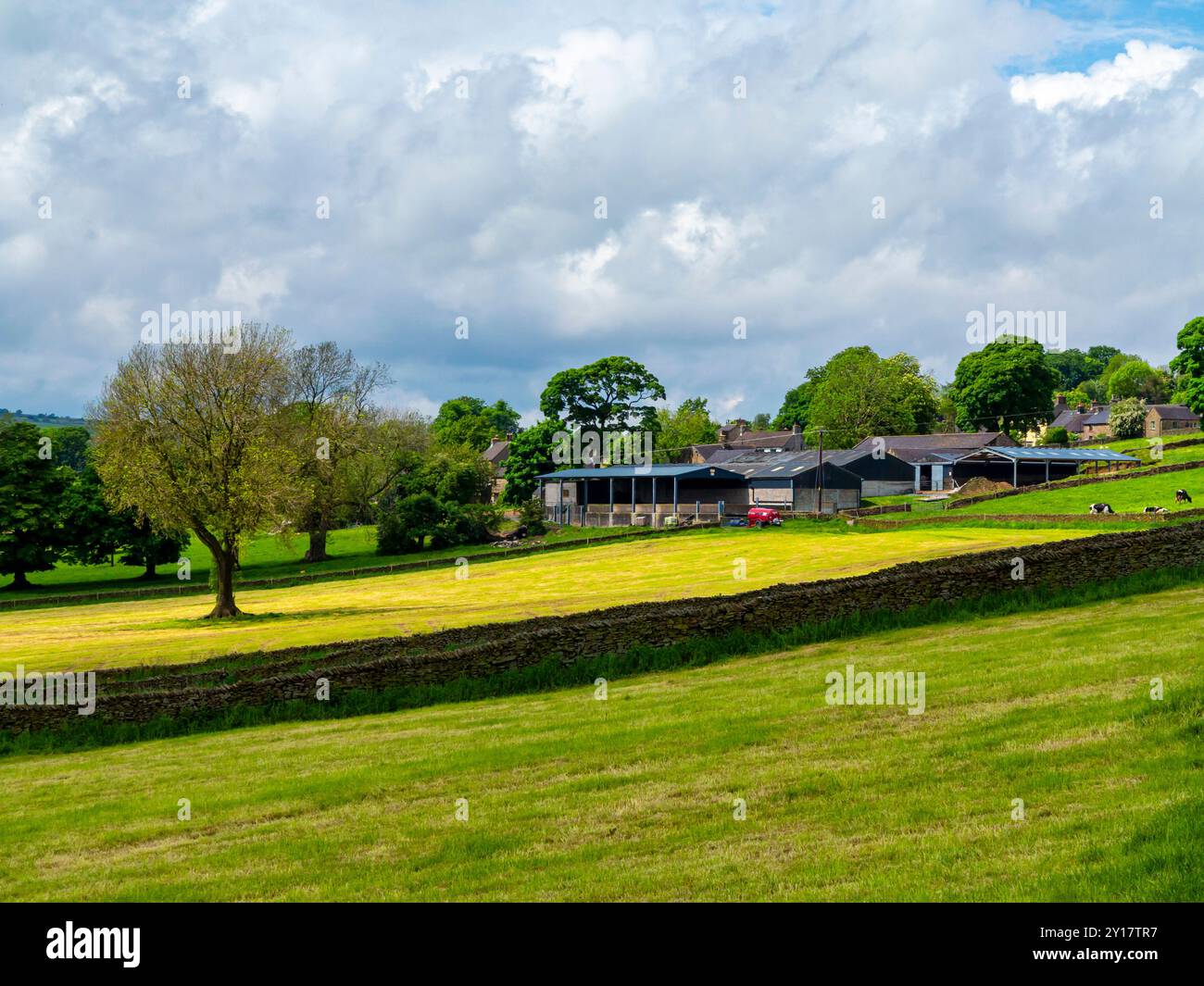 Farm buildings in landscape near Longnor in the Peak District National ...