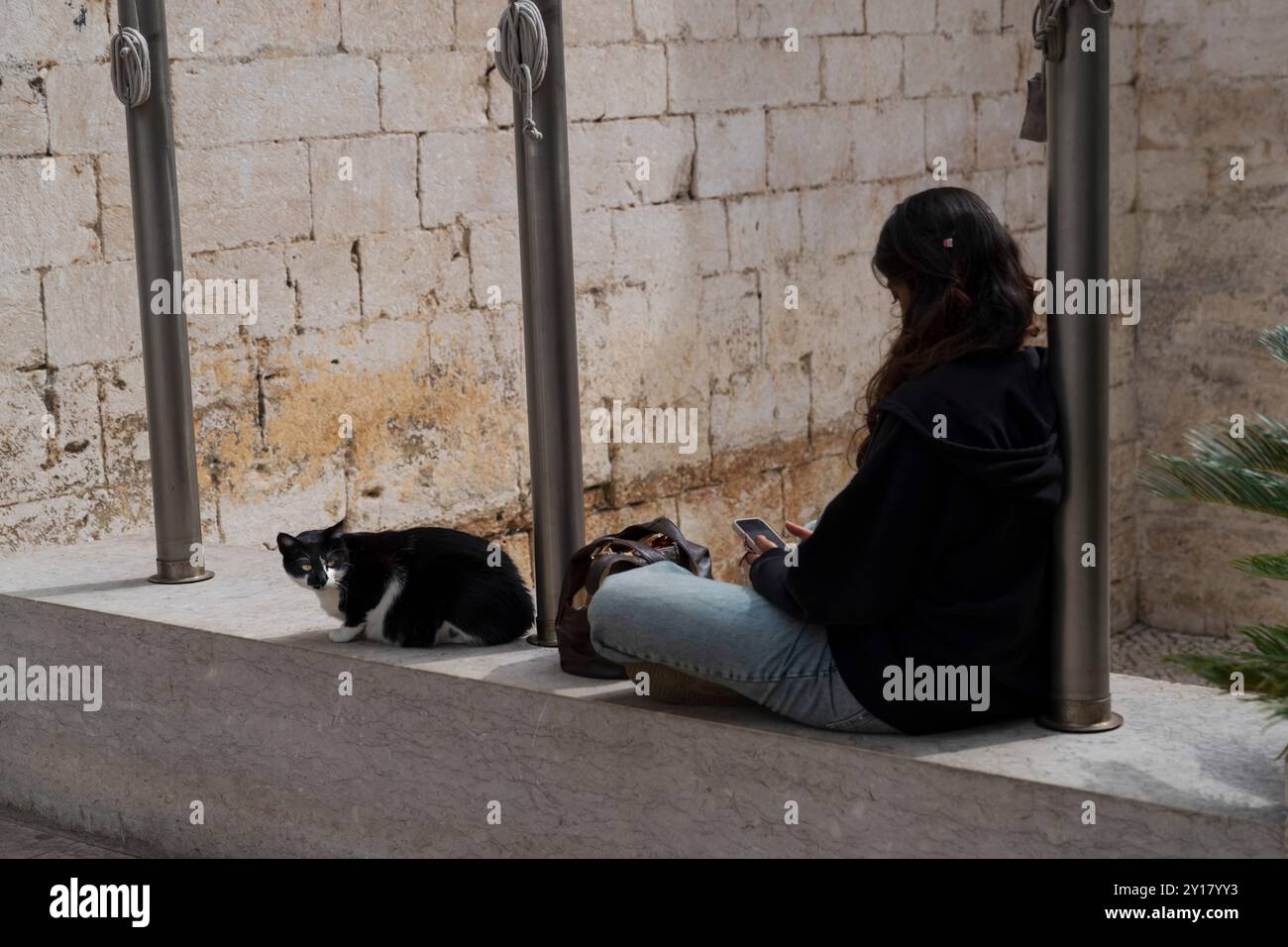 People watching in Lisbon, street photography - woman and cat in Carmo ...