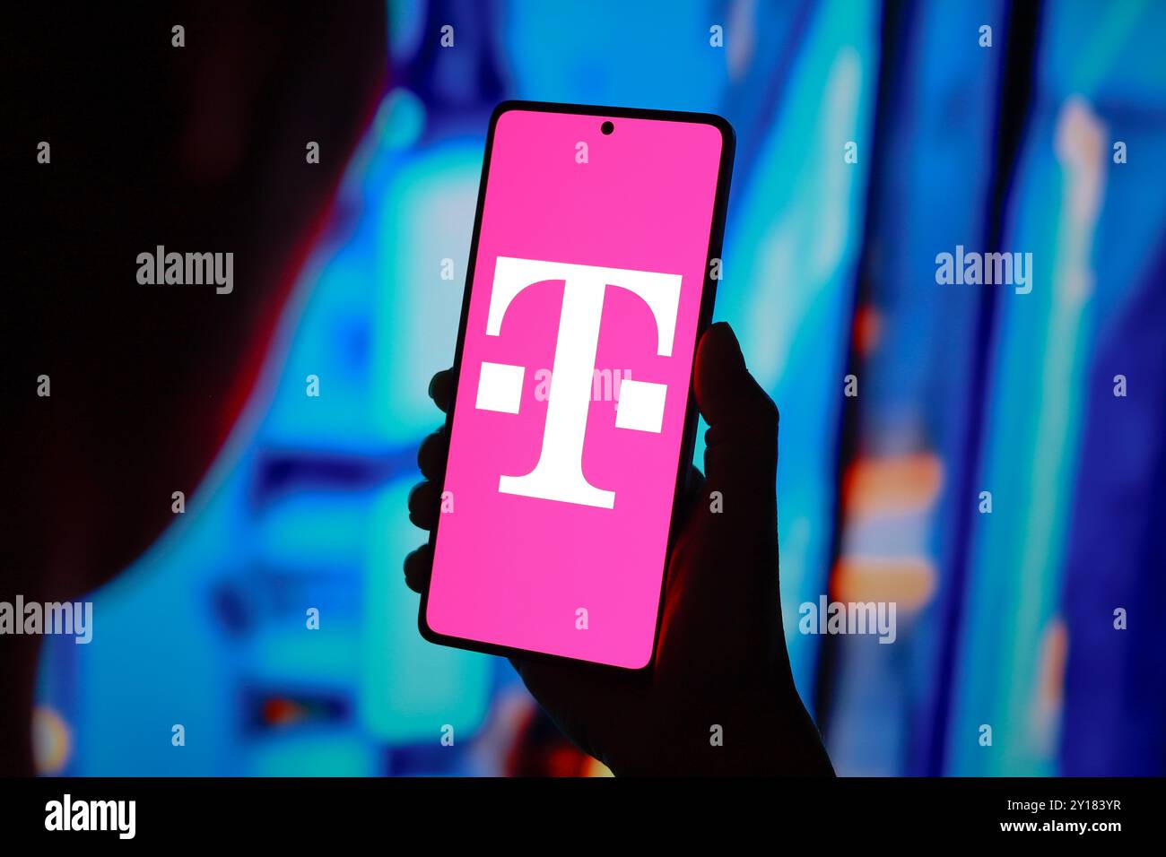 In this photo illustration, the T-Mobile (Deutsche Telekom) logo is ...