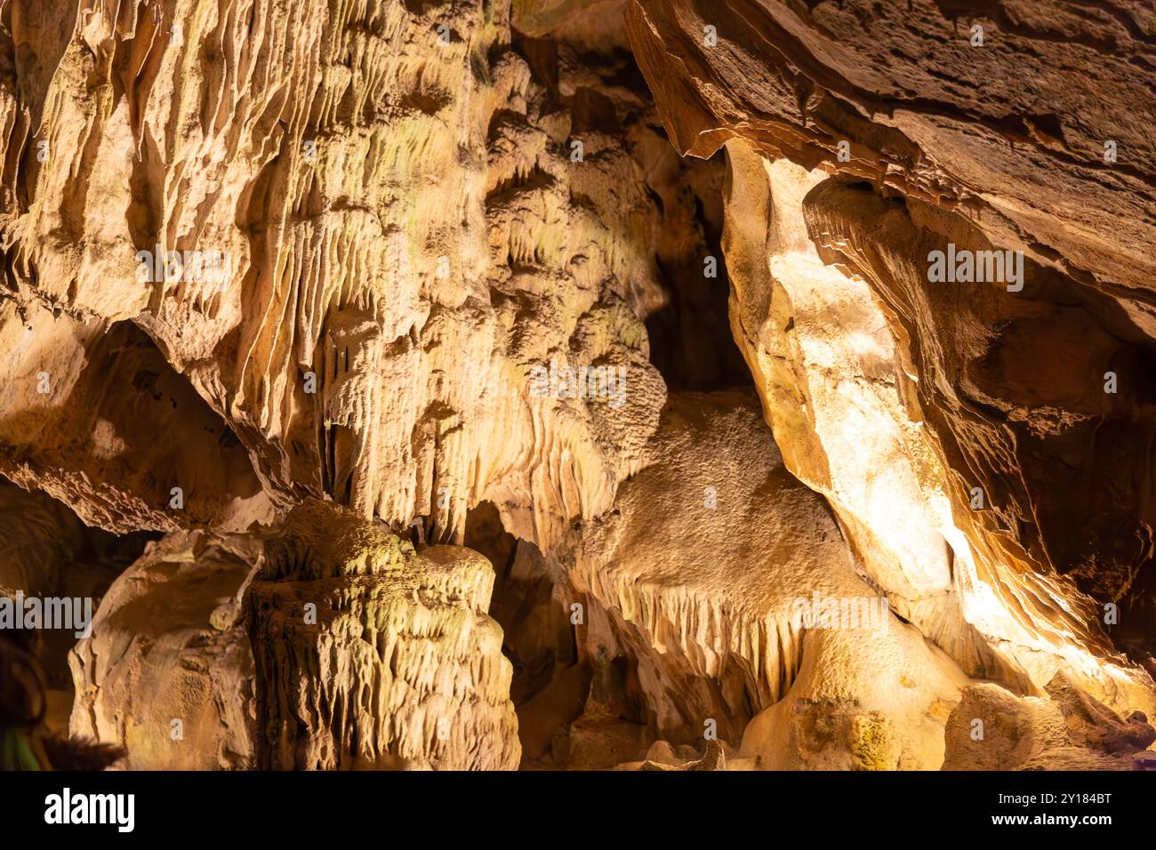 Underground rock formations in Remouchamps caves, cracked, rough and ...