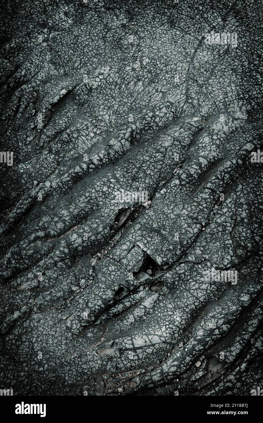 Dark grey cracked lava stone texture background Stock Photo - Alamy