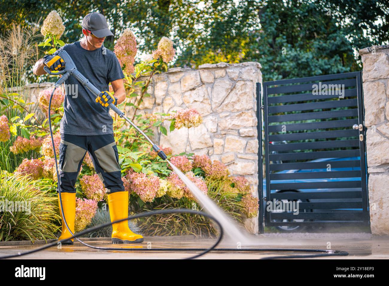 Residential gate pressure washer cleaning hi-res stock photography and ...