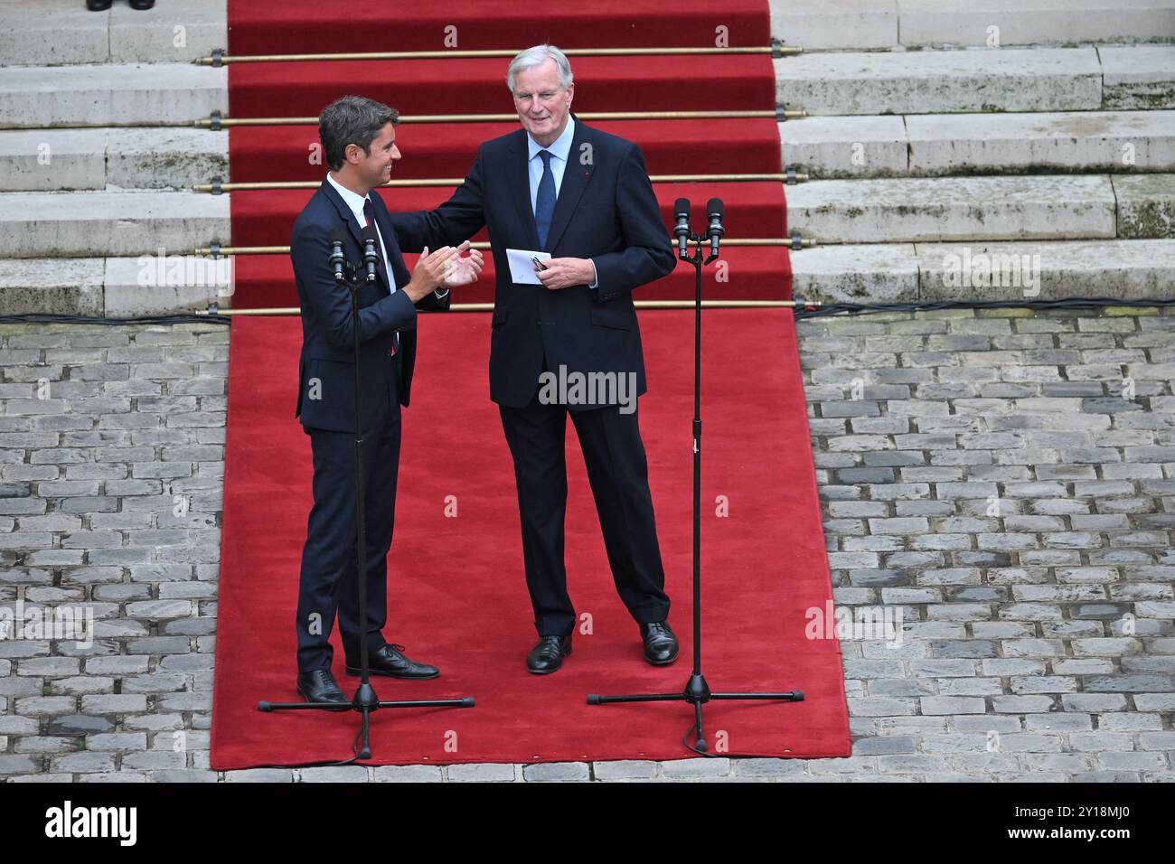 French outgoing Prime Minister Gabriel Attal and her successor Michel ...