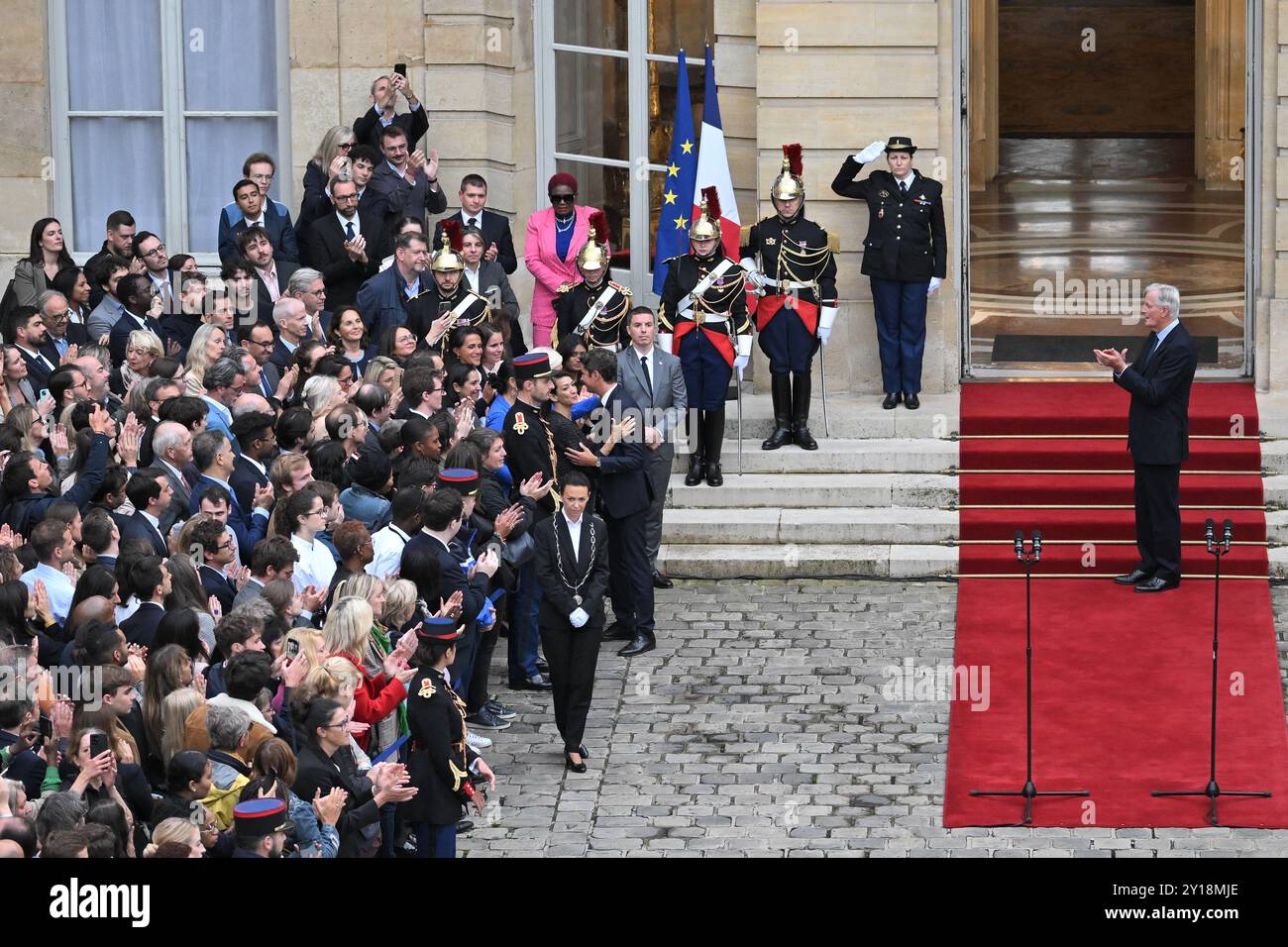 French outgoing Prime Minister Gabriel Attal and her successor Michel ...