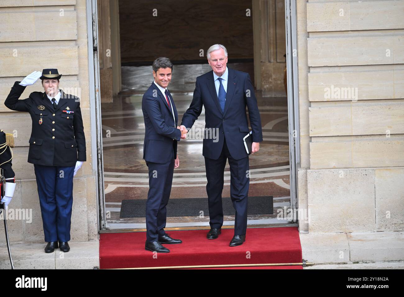 French outgoing Prime Minister Gabriel Attal and her successor Michel ...