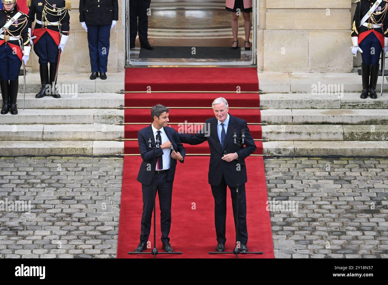 French outgoing Prime Minister Gabriel Attal and her successor Michel ...
