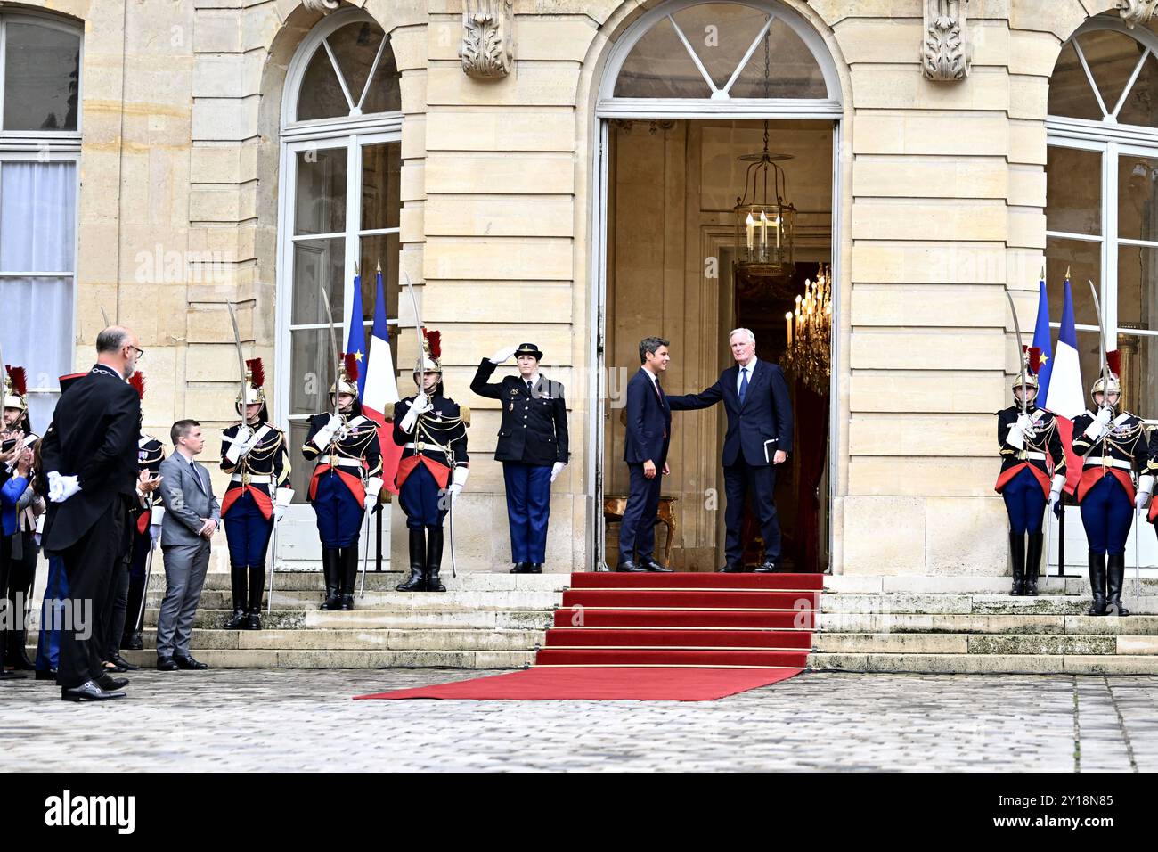 French outgoing Prime Minister Gabriel Attal and her successor Michel ...