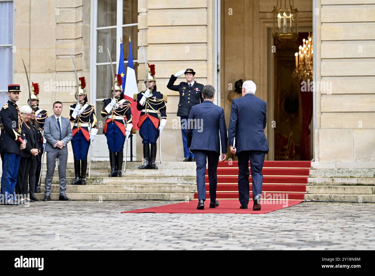 French outgoing Prime Minister Gabriel Attal and her successor Michel ...