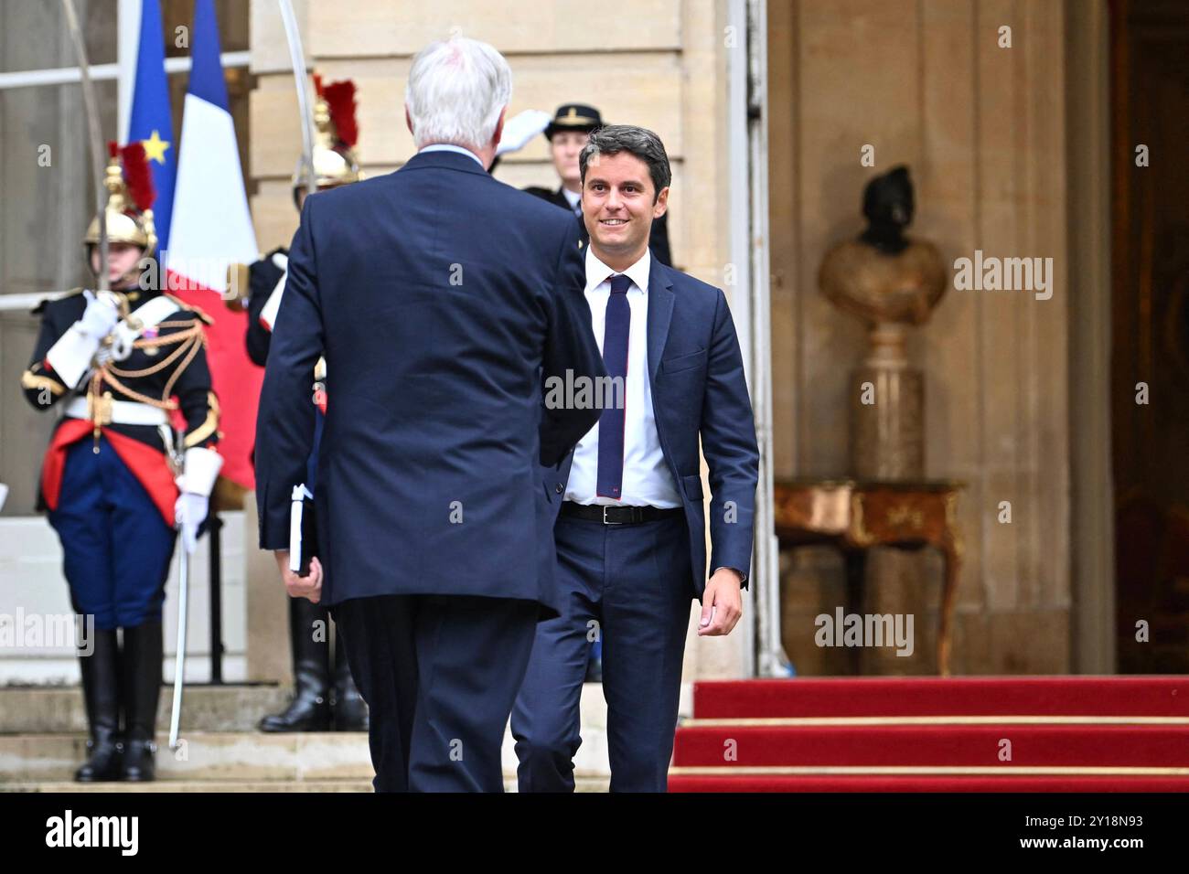 French outgoing Prime Minister Gabriel Attal and her successor Michel ...