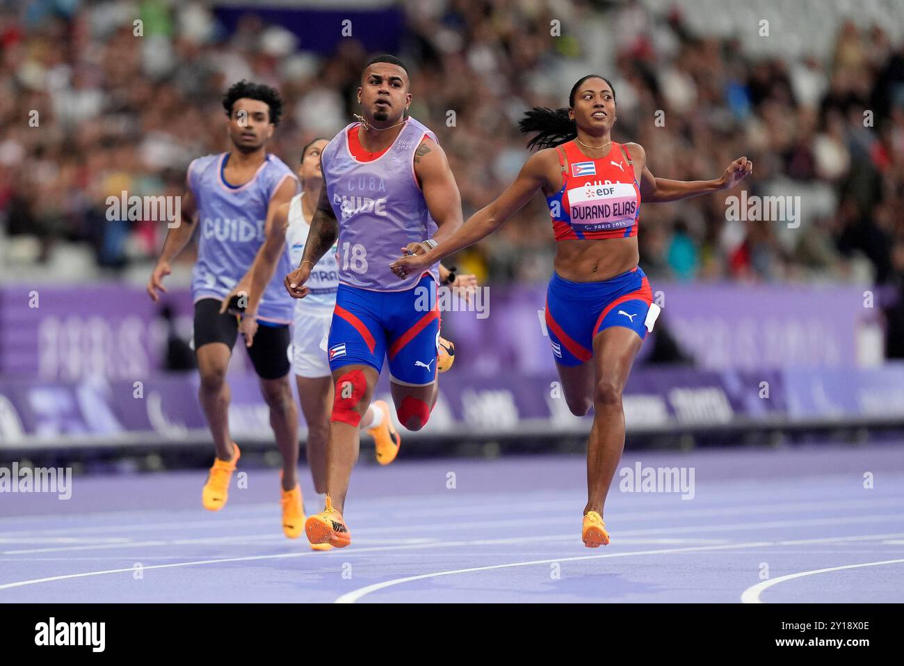 Cuba’s Omara Durand Elias and Guide Yuniol Kindelan Vargas on their way ...