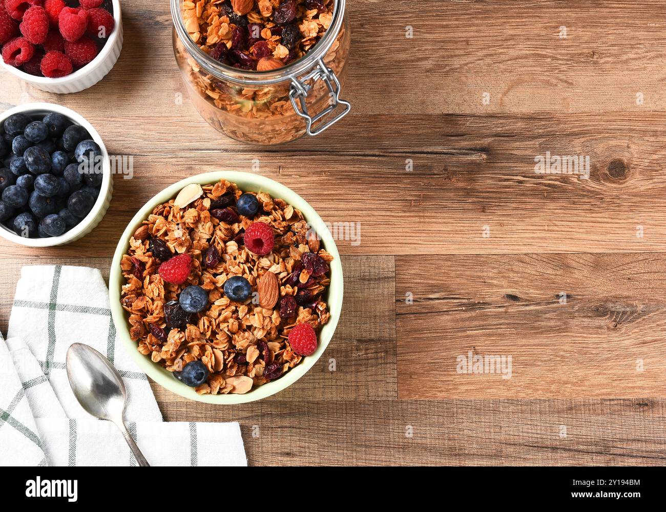 A bowl of Granola cereal with fresh fruit. Horizontal with copy space ...