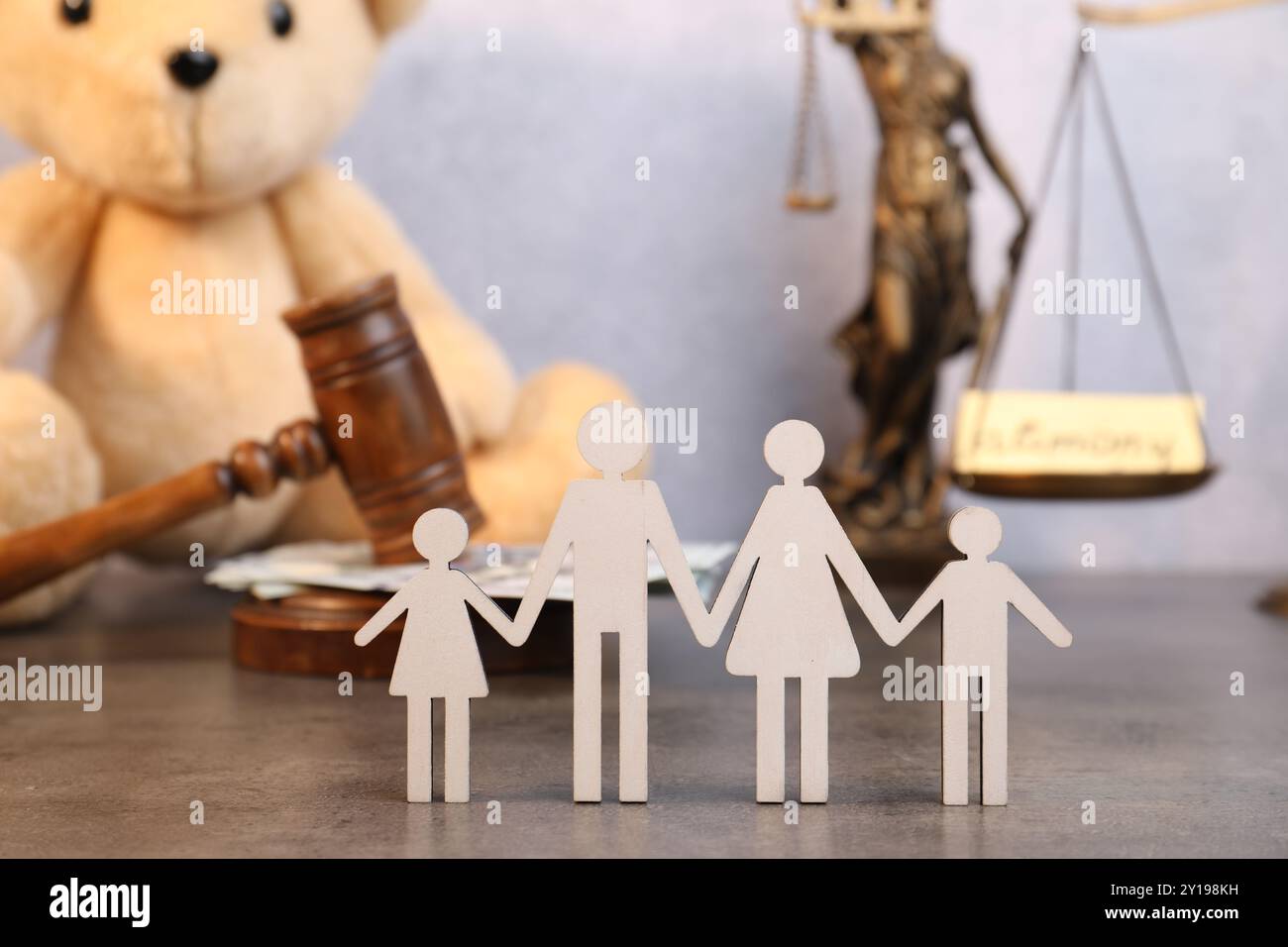 Alimony concept. Figures of family on grey table, closeup Stock Photo ...