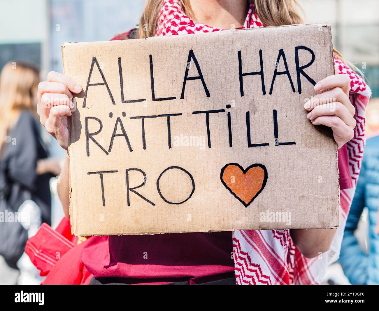 Stockholm, Sweden - August 24 2024: A pair of female hands holding a ...