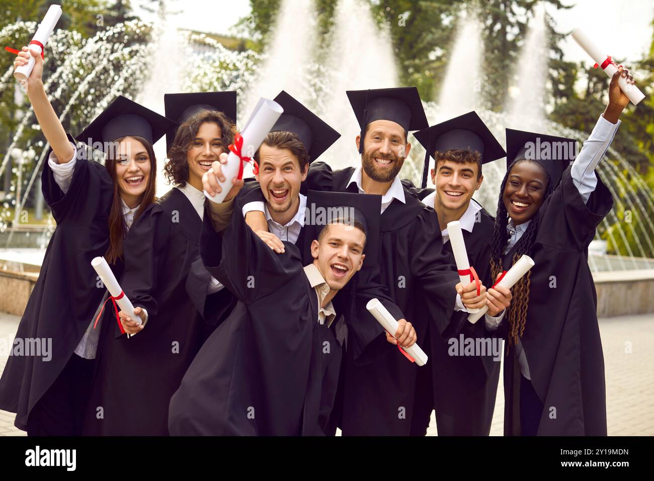 Happy excited university students during graduation are happy to ...