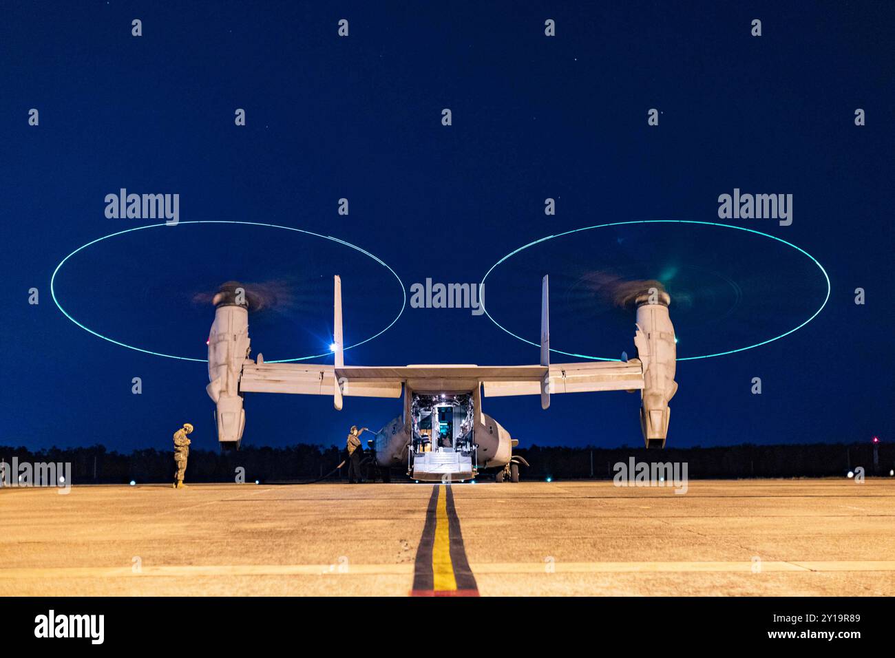 U.S. Marines Tiltrotor MV-22 Osprey transport aircraft with Marine ...