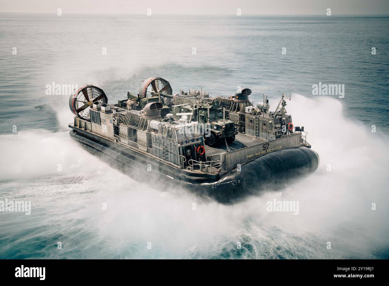 U.S. Navy Landing Craft, Air Cushion (LCAC) 57 transports personnel and equipment ashore Stock ...