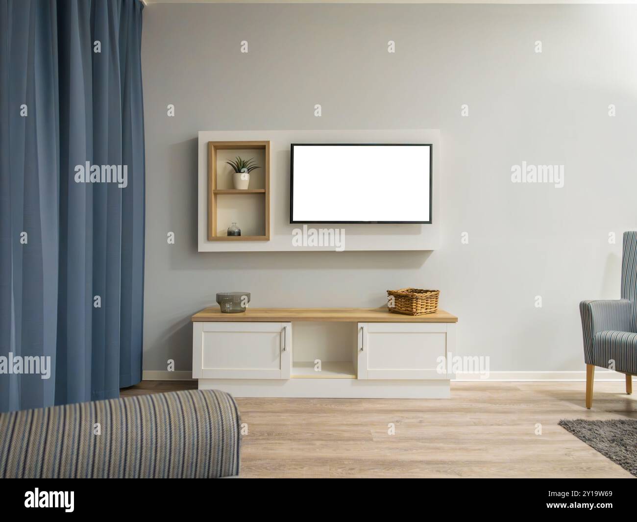 TV screen template in a living room. Blank display mockup with a white ...