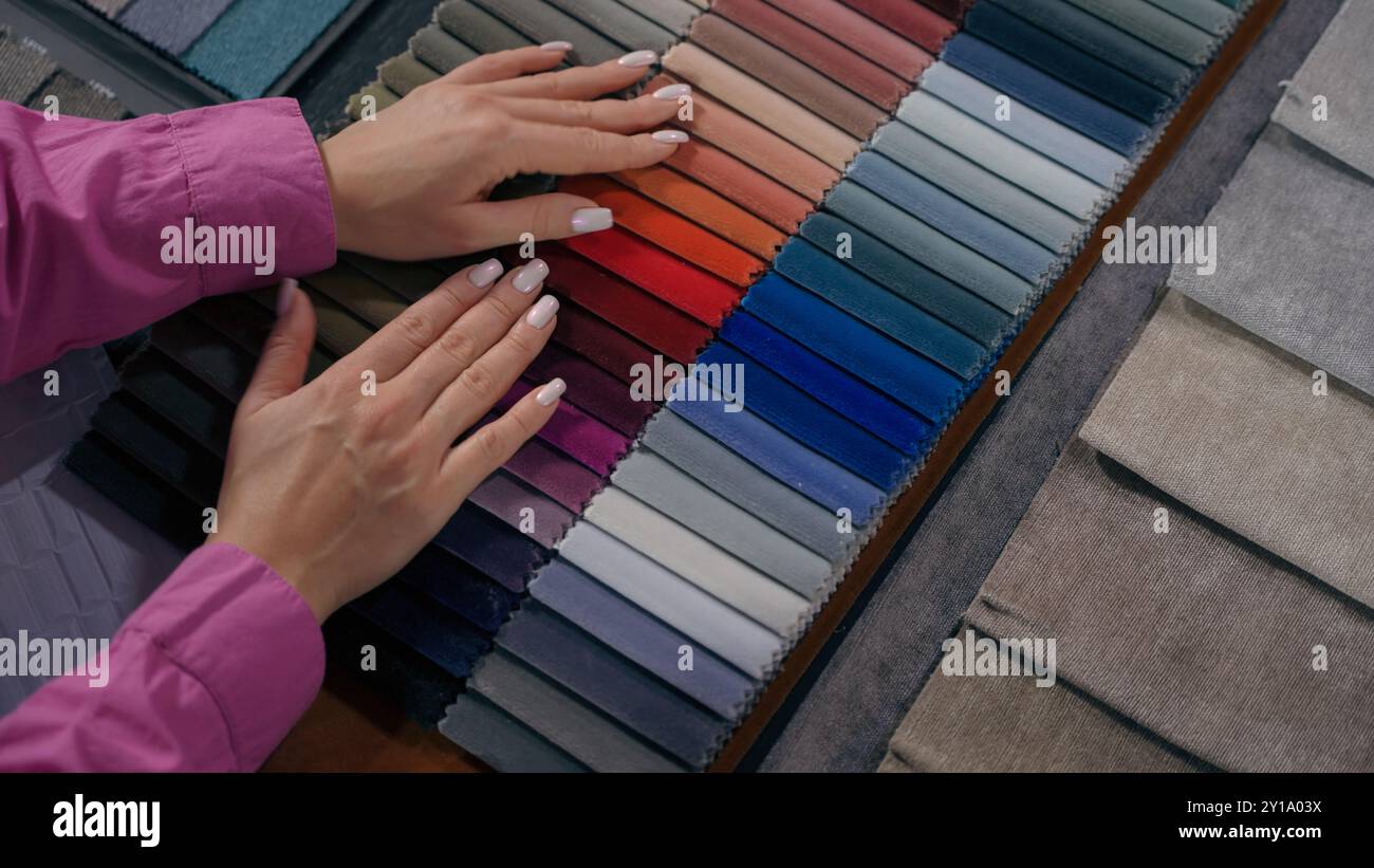 Top view female hands arms touch soft velvet cloth samples eco natural ...