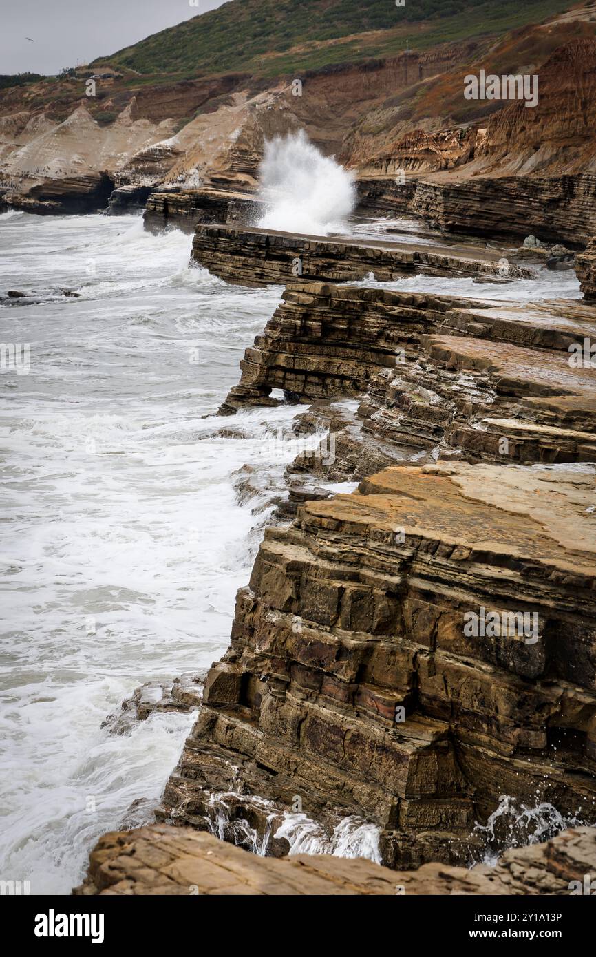 Pacific Ocean waves hit the cliffs at Point Loma in San Diego ...