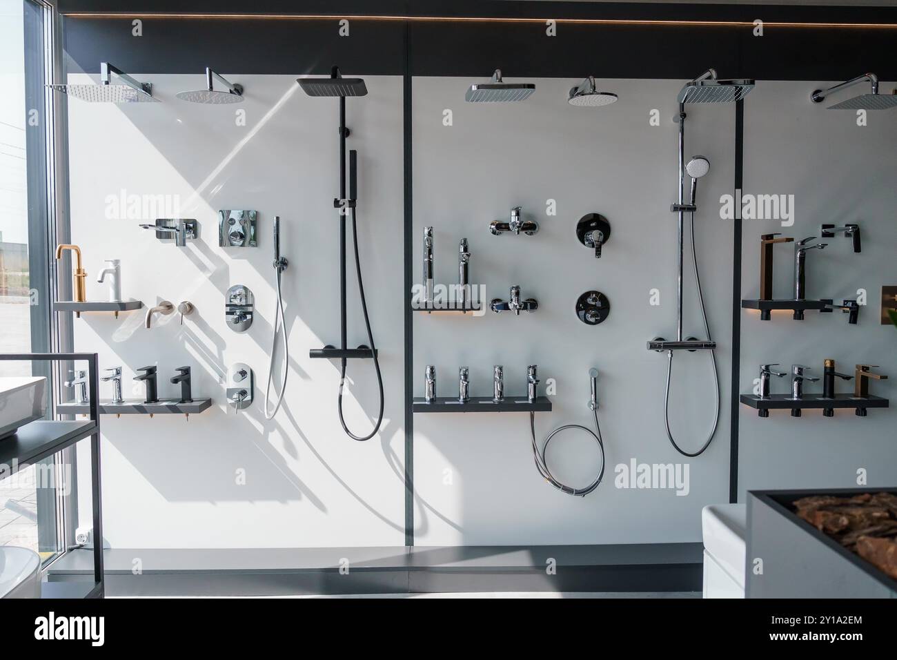 Modern Bathroom Faucet Display in Sunlit Showroom Stock Photo - Alamy