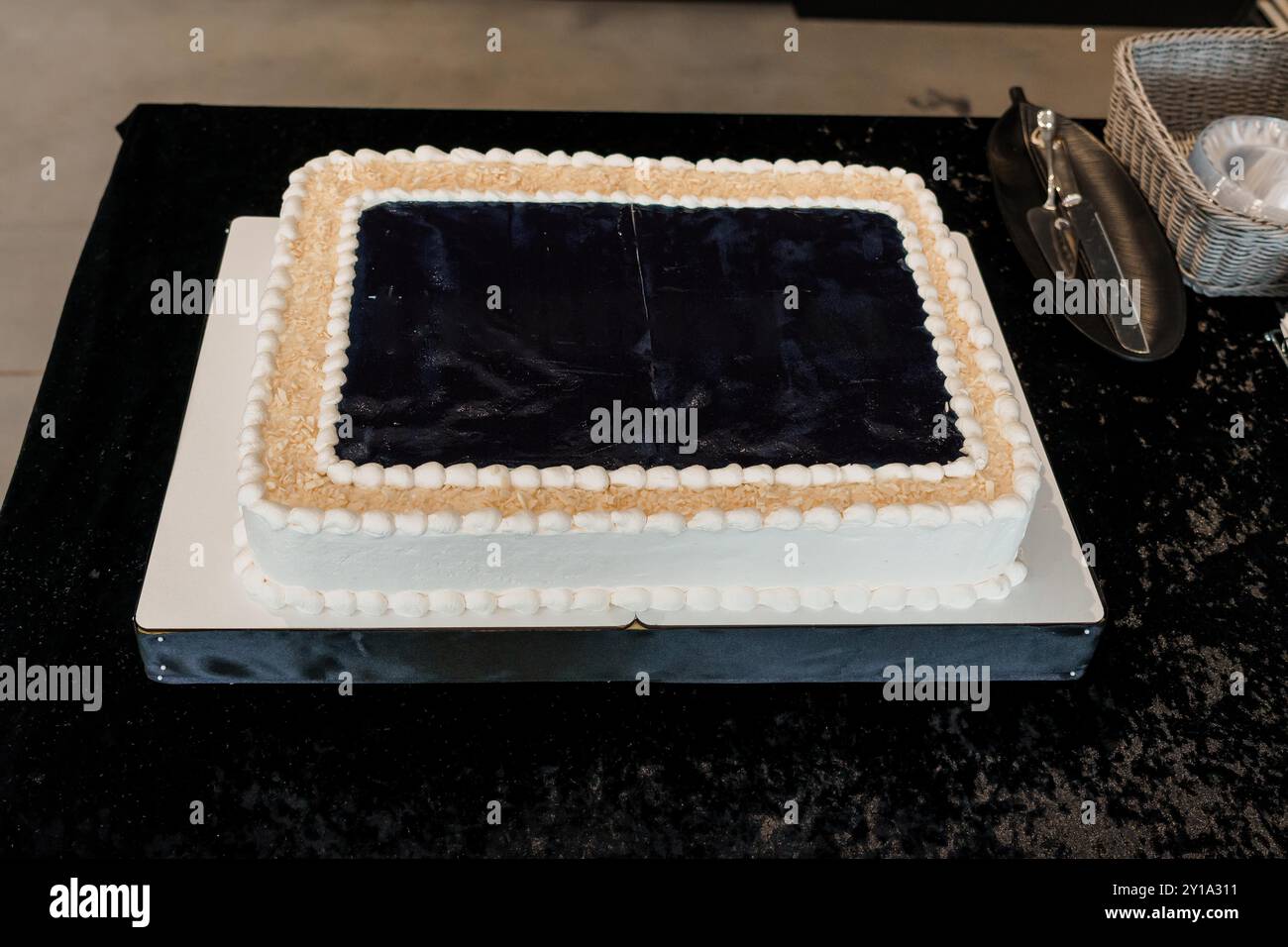 Elegant Rectangular Cake on Black Velvet Surface with Vanilla Frosting ...