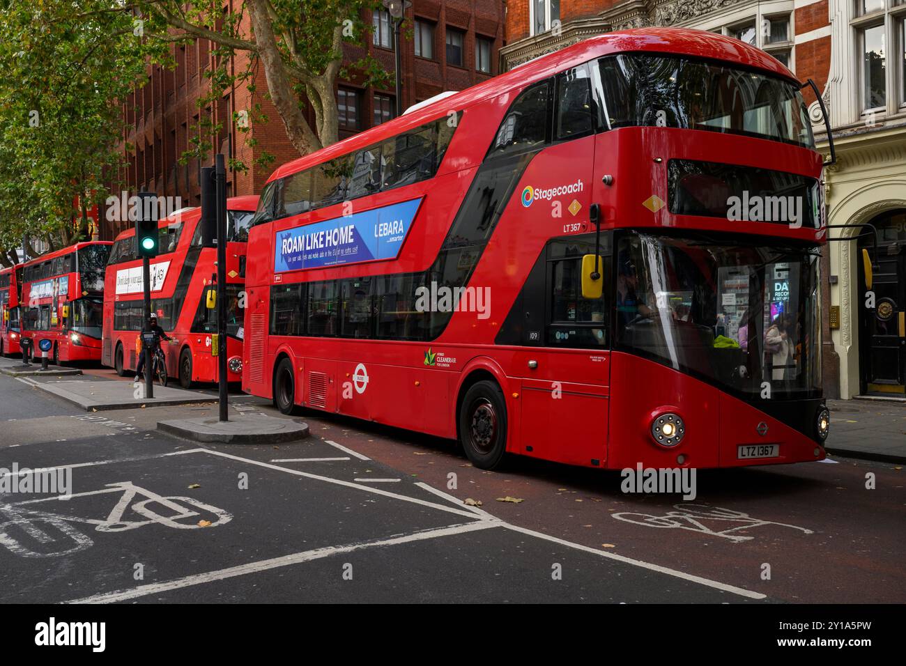 A line of buses, with two New Routemaster buses at the front, Charing ...