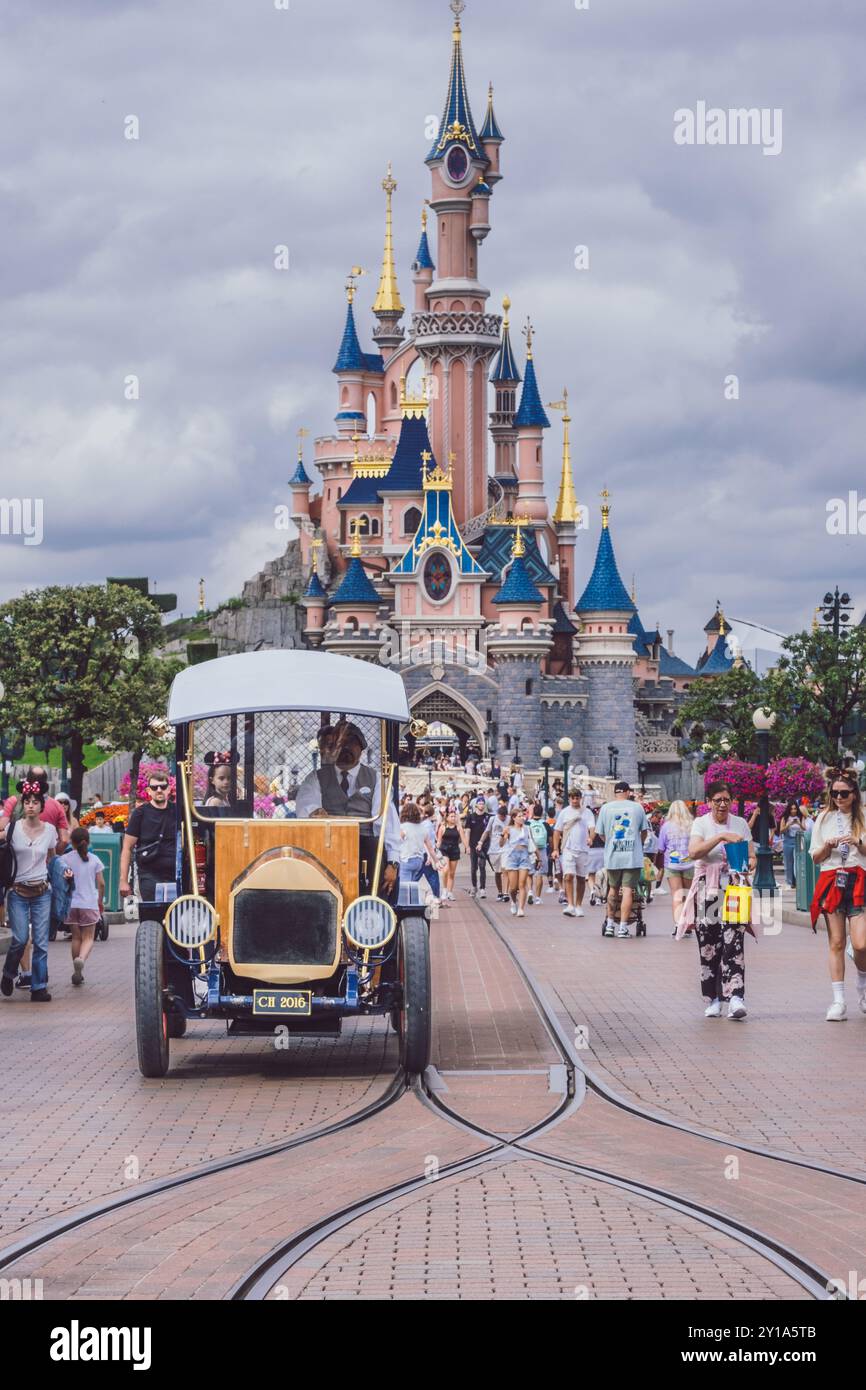 Disneyland Paris, main street with sleeping beauty castle in the ...