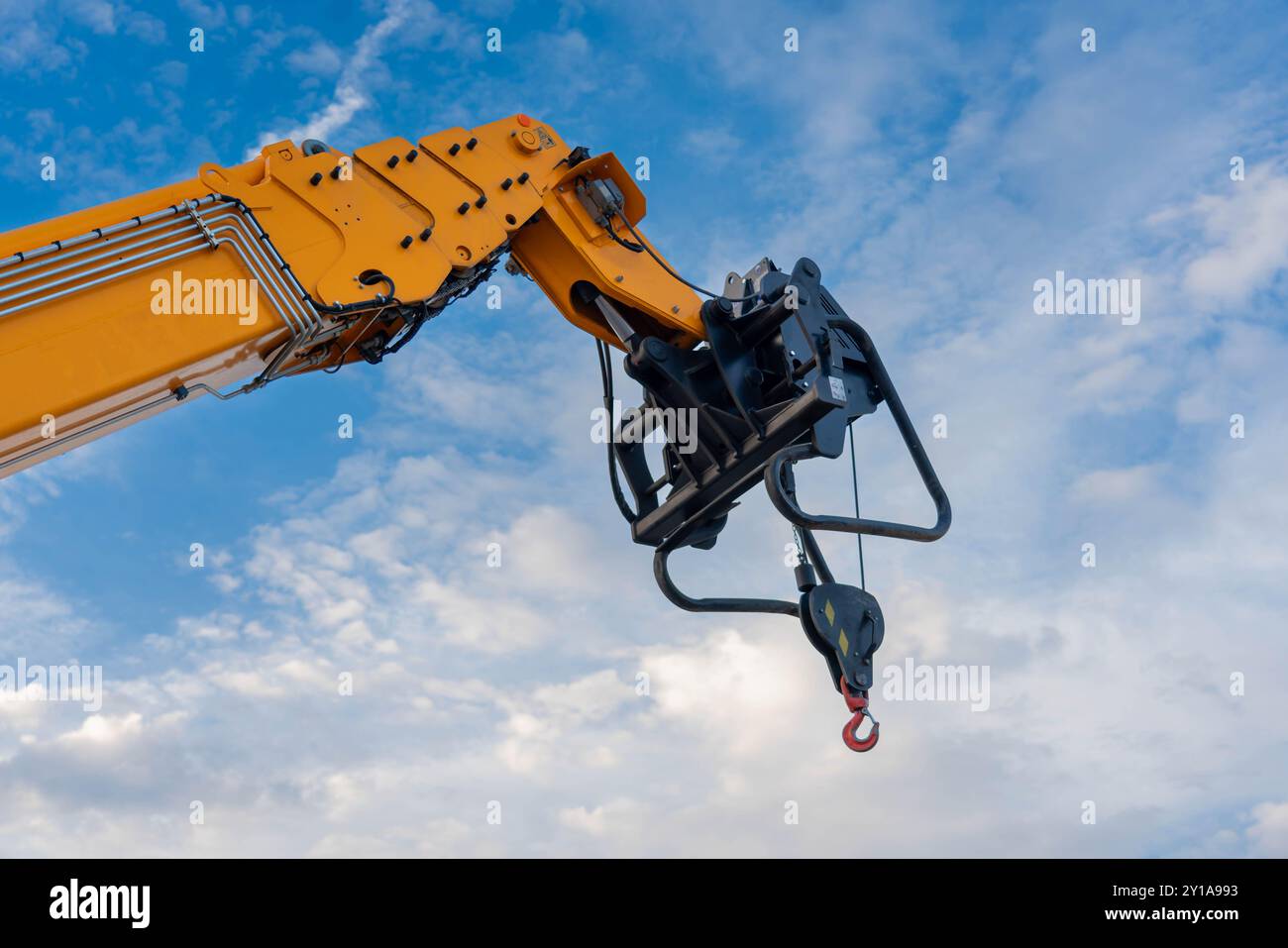 A lifting mechanism with a hook at the end of the boom of a heavy truck ...