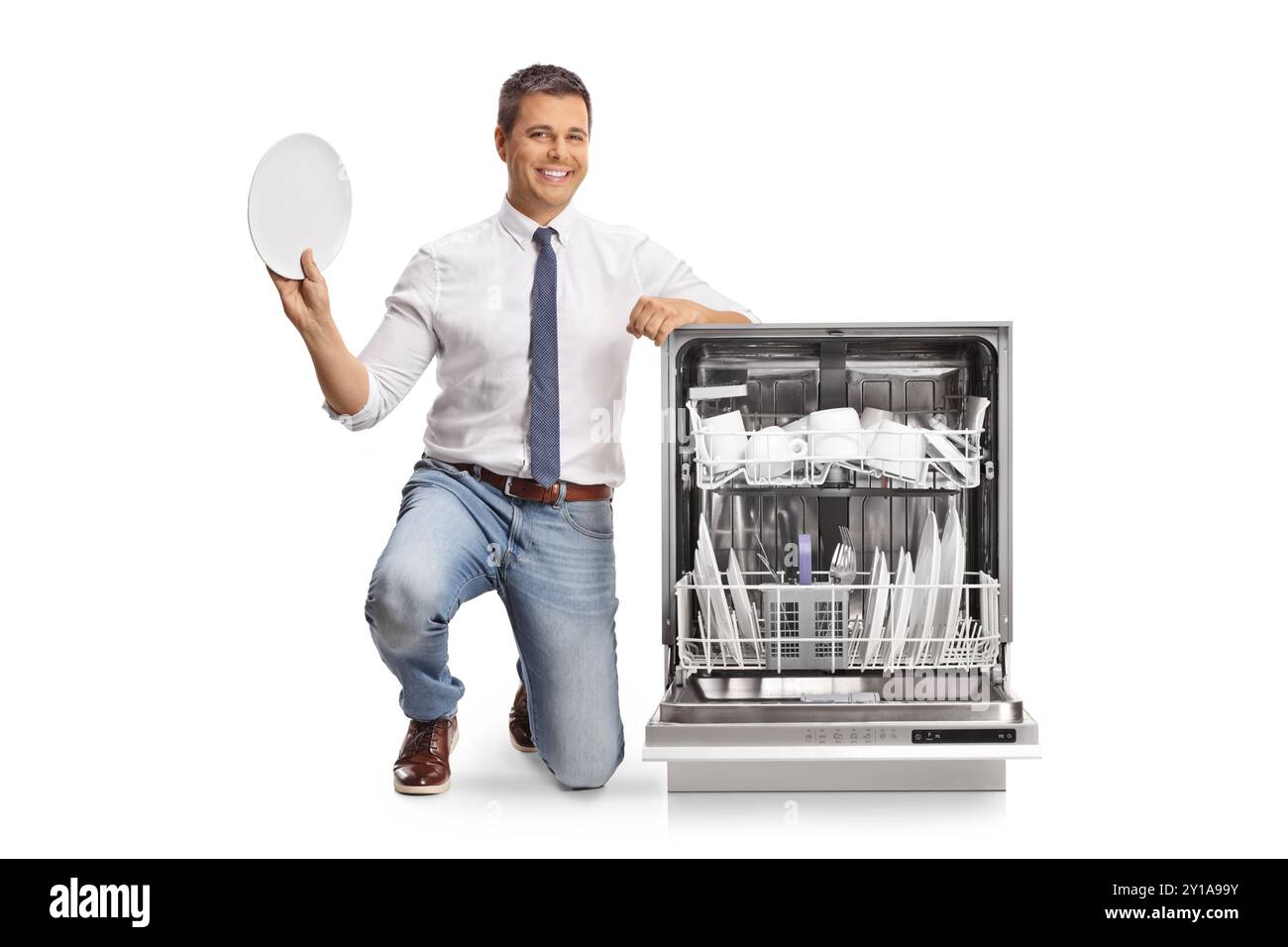 Happy man holding a clean plate from a dishwasher isolated on white ...