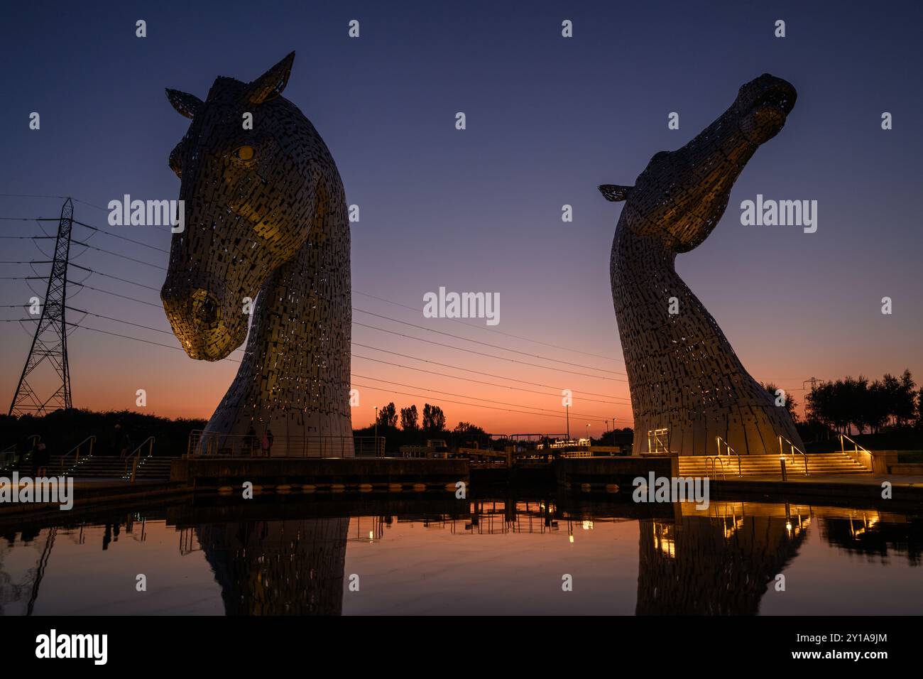 Iconic Scottish Tourist Attraction, The Kelpies, Reflect In The Water ...