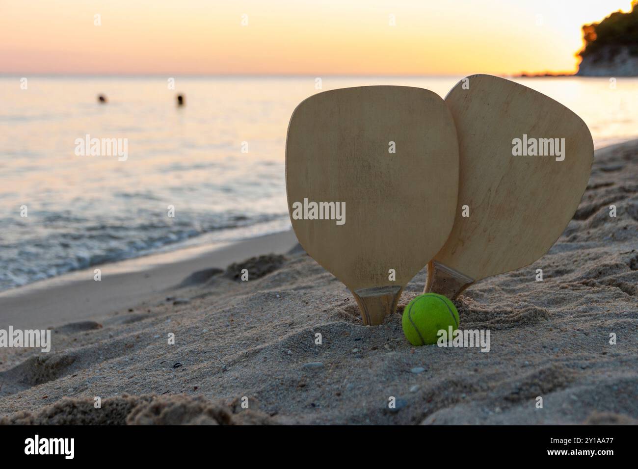 Beach tennis, beach paddle ball. Beach rackets and ball on the beach ...