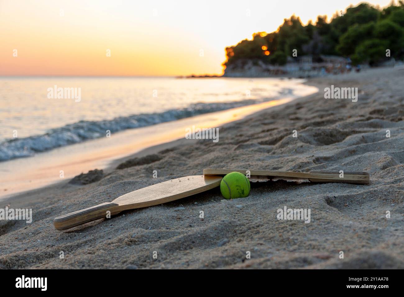 Beach tennis, beach paddle ball. Beach rackets and ball on the beach ...
