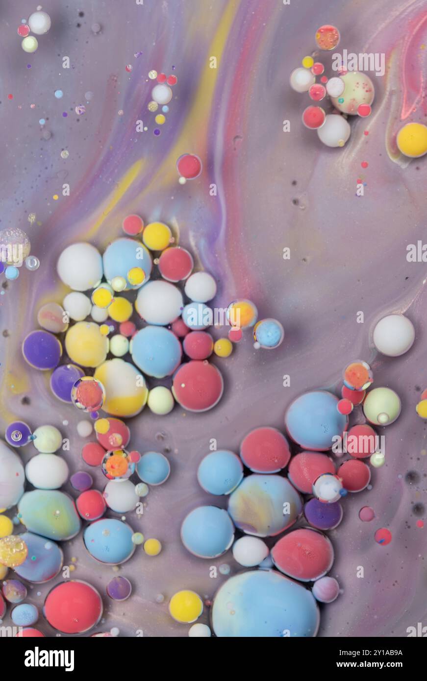 Colorful abstract patterns created by floating droplets in vibrant ...