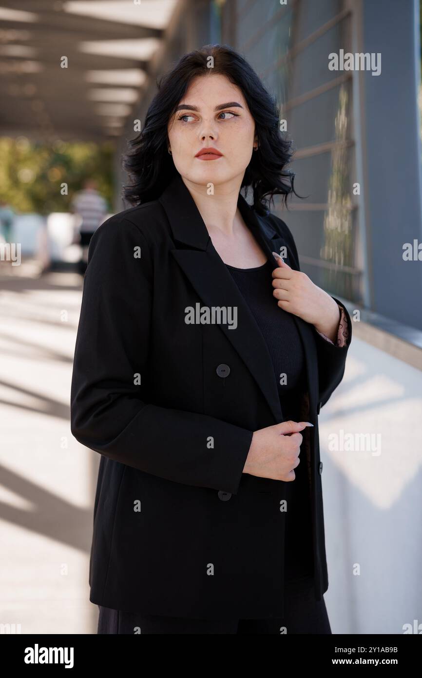 Professional woman in black blazer hi-res stock photography and images - Alamy