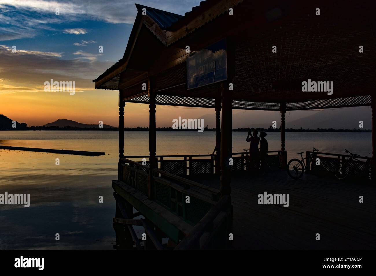 Visitors take photos during sunset in Srinagar, the summer capital of ...