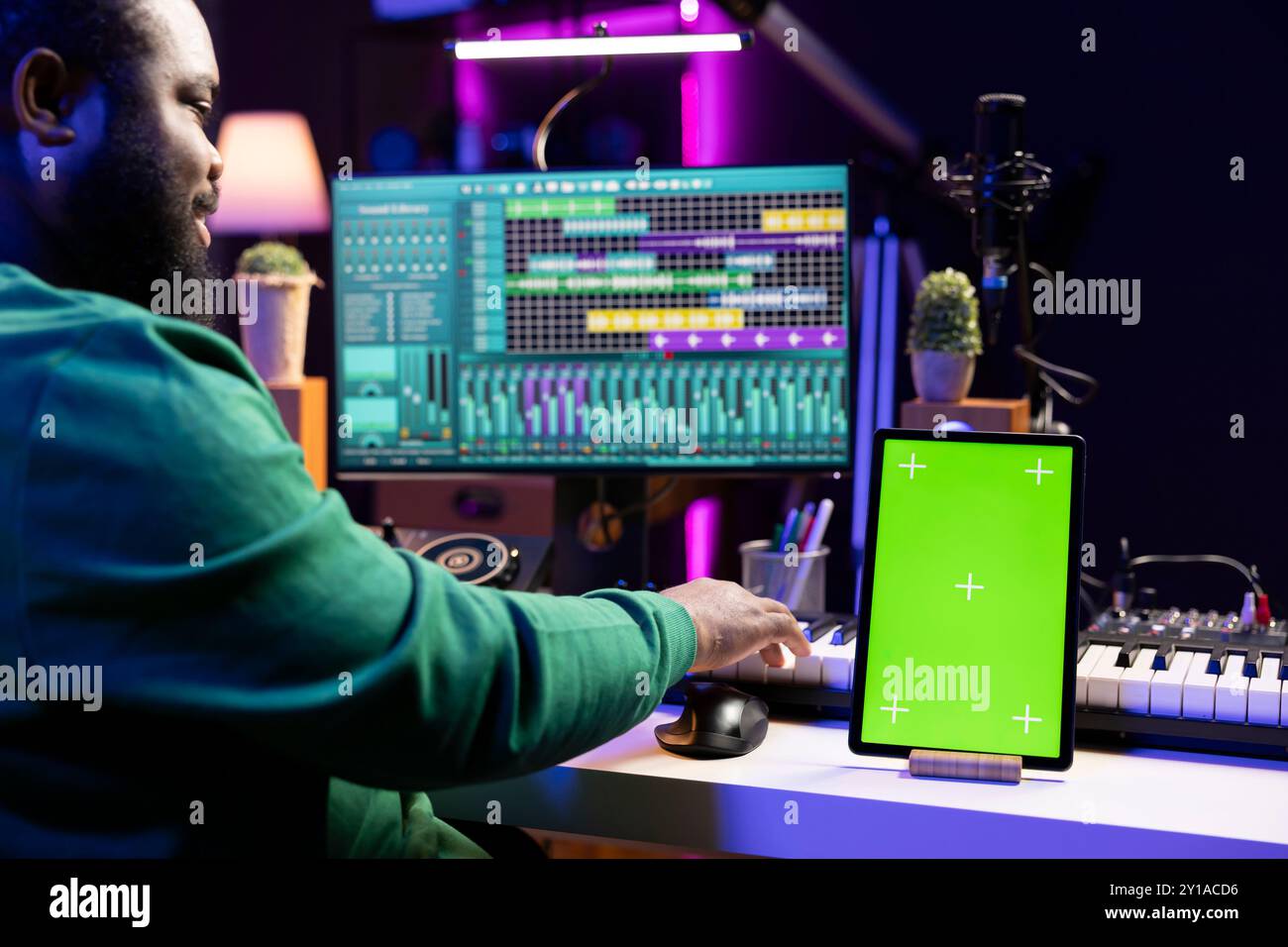 Sound designer producing new soundtracks with digital software, having ...