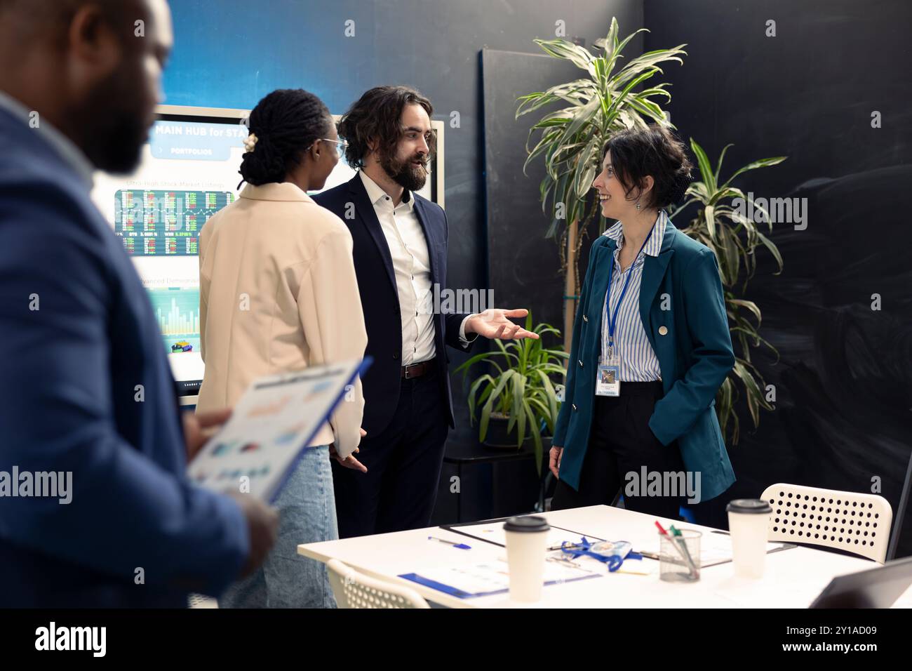 Crew of staff members assembling in an overview conference to devise ...