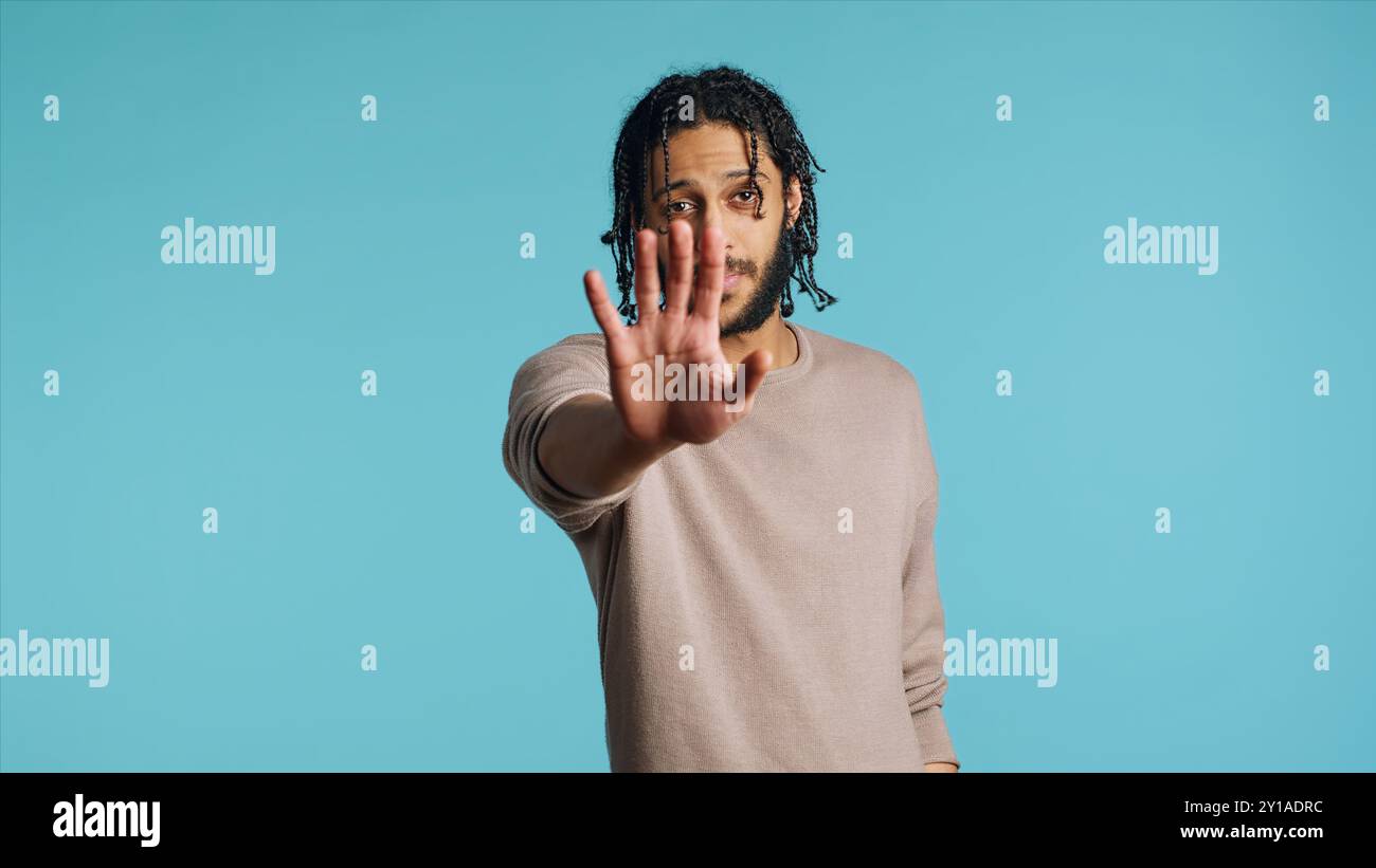 Assertive Middle Eastern man asking for timeout, doing hand gestures ...