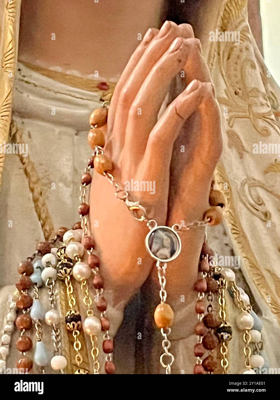 Closeup of Hands, Statue of the Virgin Mary with Rosary Beads, The ...