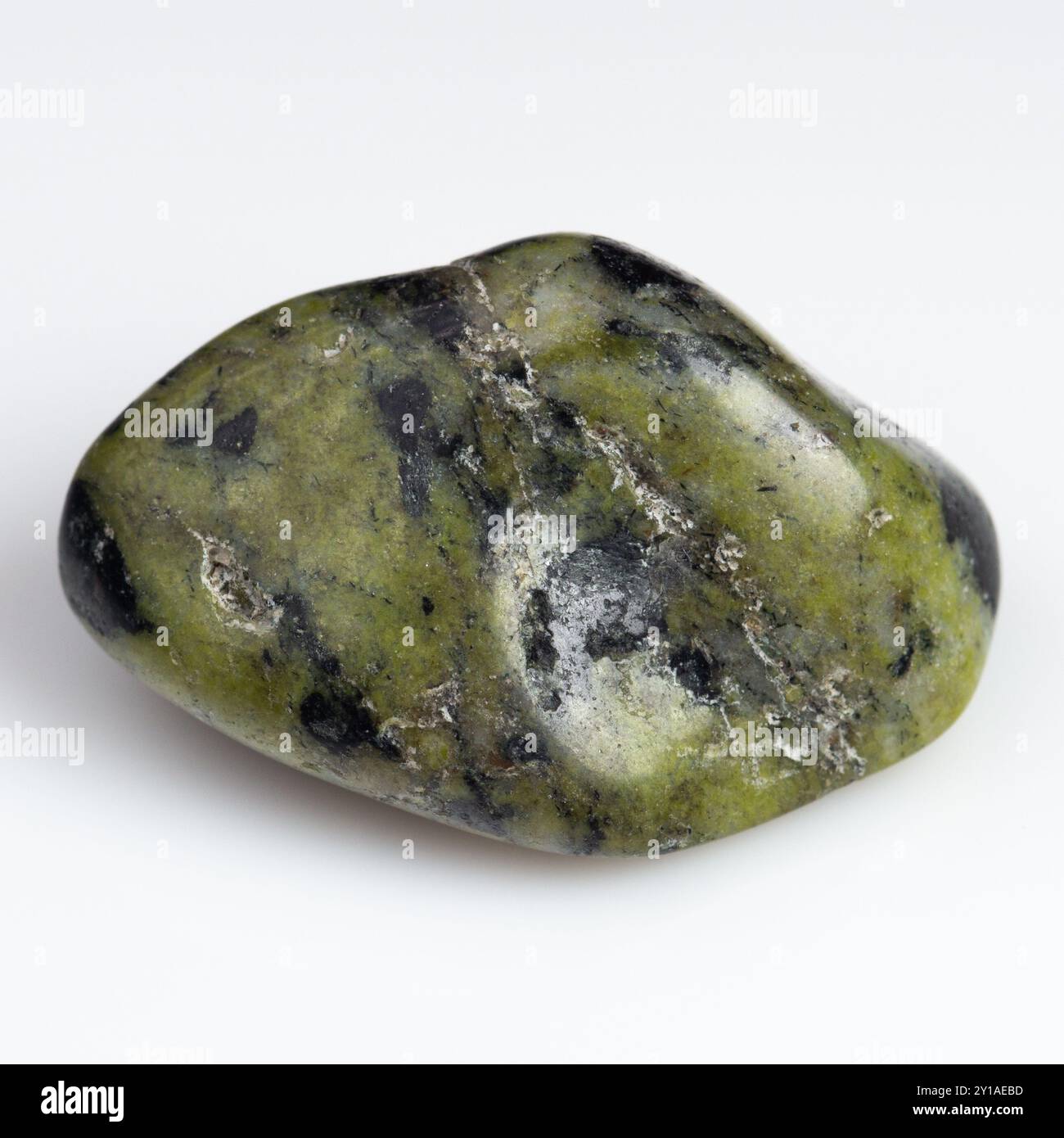 Mesmerizing Green Serpentine Stone with Natural Patterns on White ...