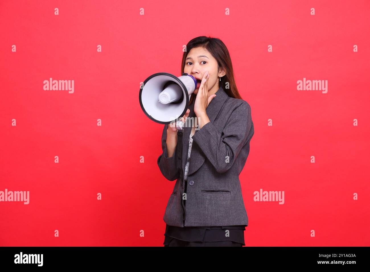 Asian office woman's expression tilted to the right, shouting angrily ...