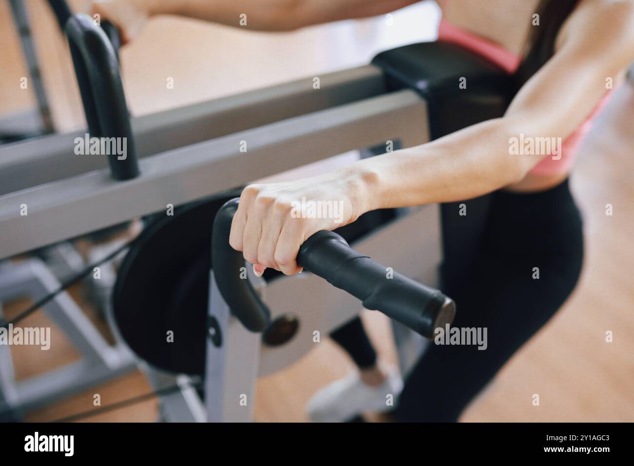 Woman Doing Rowing Machine Exercise Repetition Stock Photo - Alamy