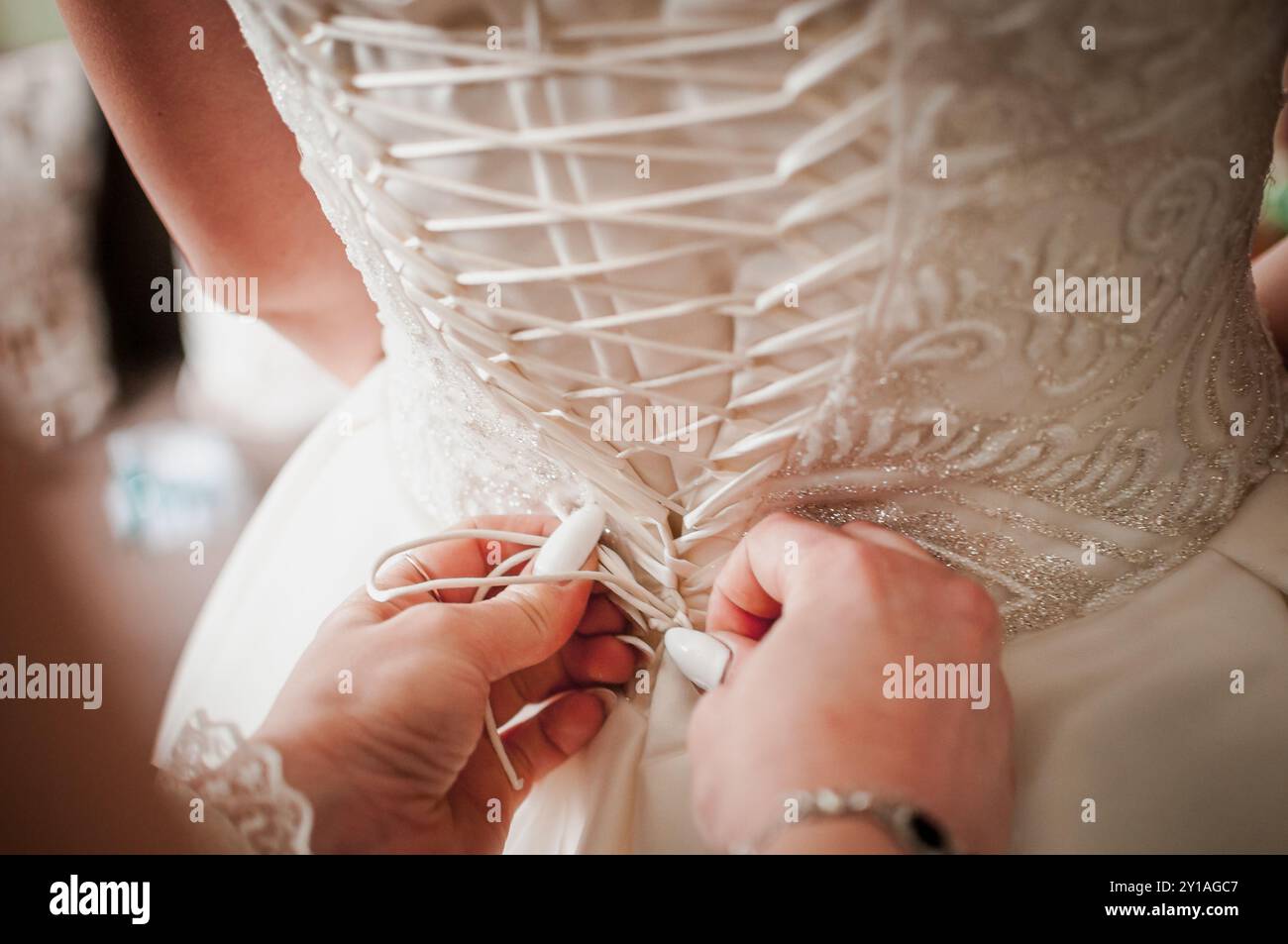 Tying corset hi-res stock photography and images - Alamy