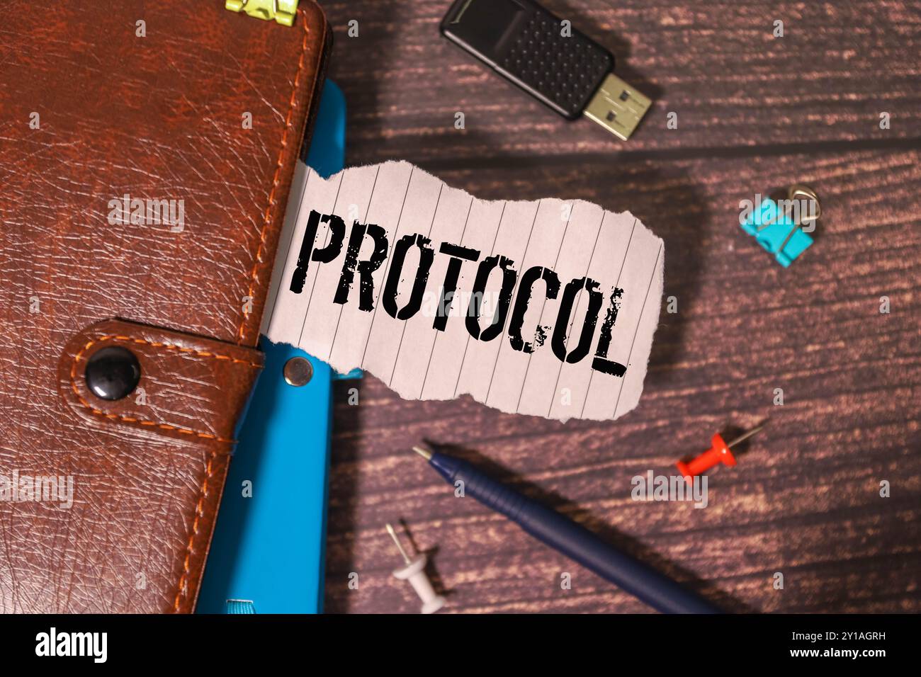 Business concept. Text PROTOCOL is written in a notebook in a ...