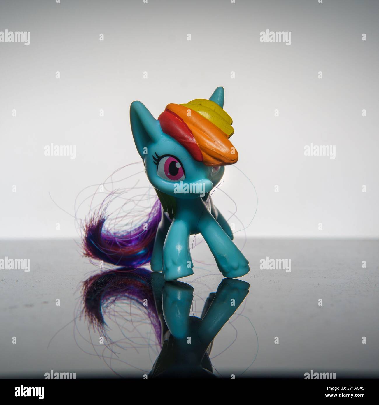 Colorful Toy Pony Reflection on Shiny Surface Stock Photo - Alamy