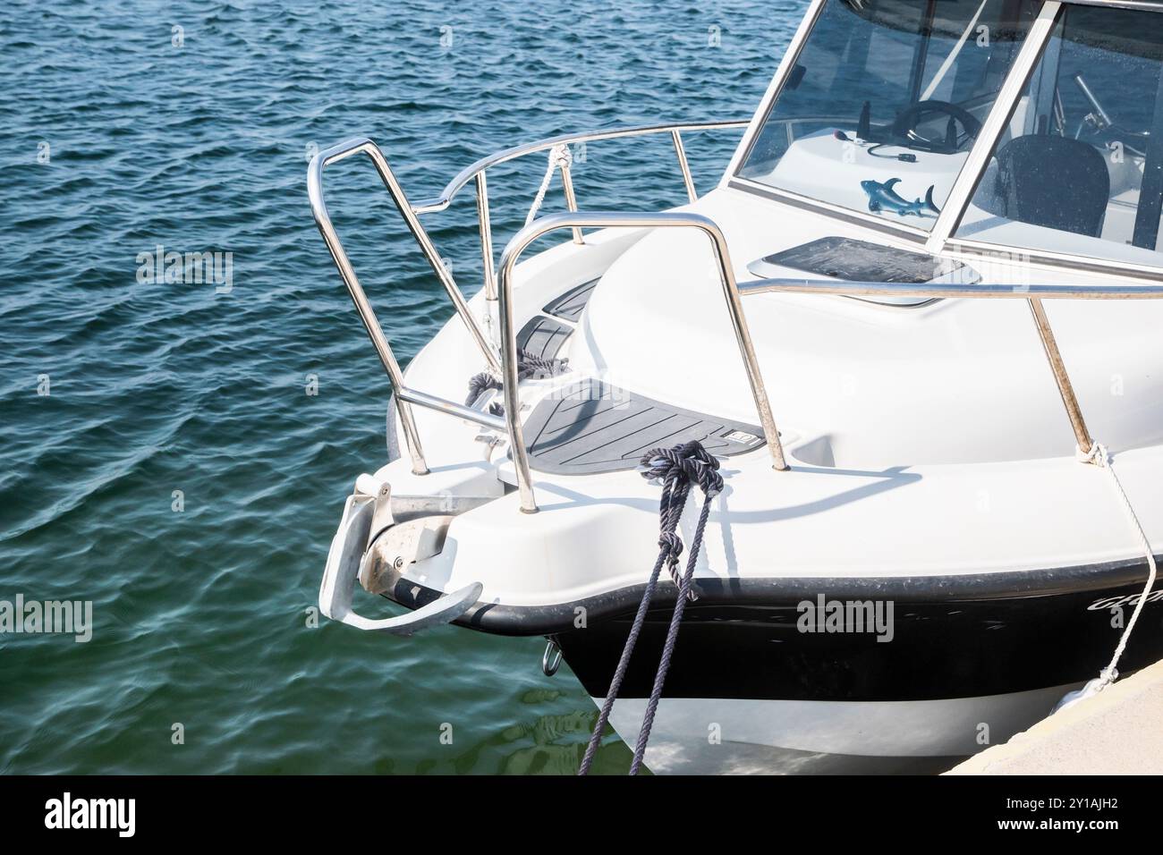 Sailing boat bow with mantus anchor on sea waters background Stock ...