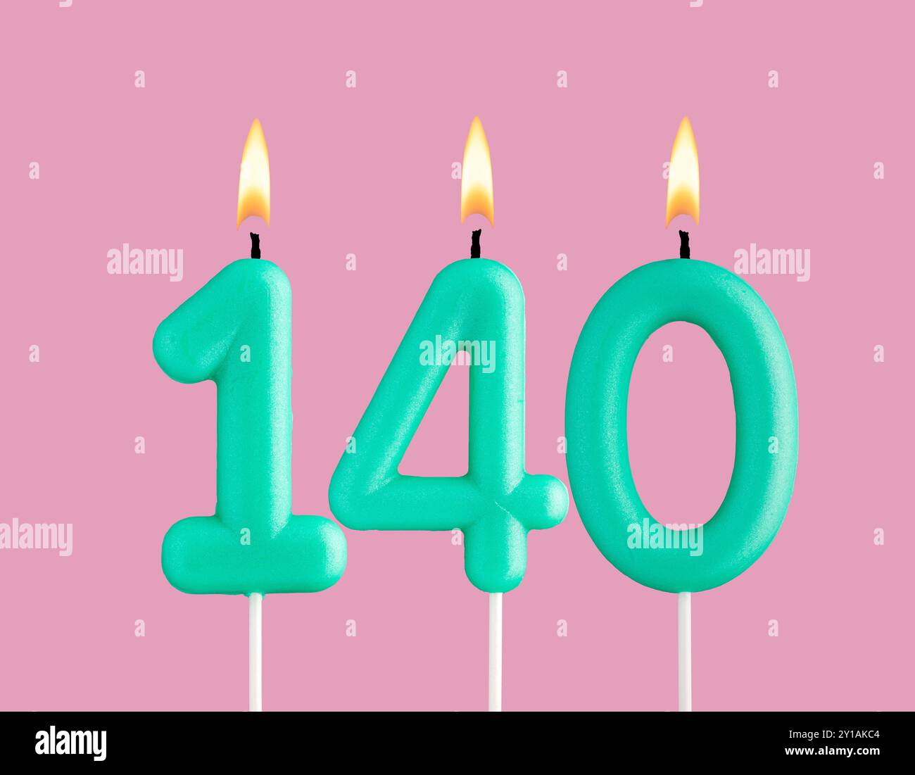 Green candle number 140 - Birthday card on pastel pink background Stock Photo - Alamy