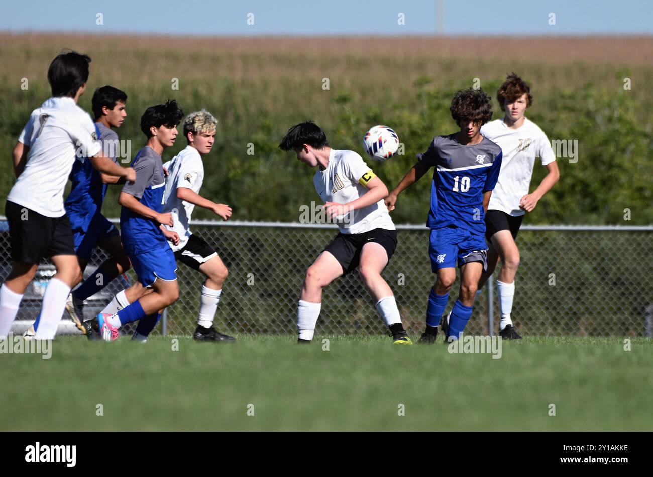 Illinois, USA. Defender turns toward the flight of the ball after ...