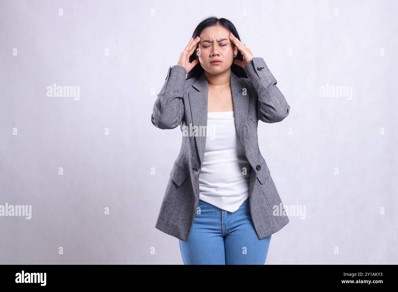 expression of beautiful young office woman close eyes dizzy both hands ...