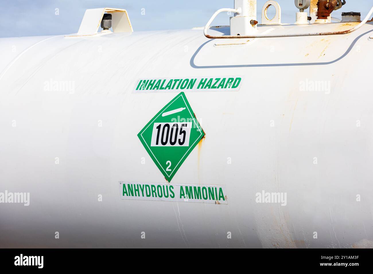 Anhydrous ammonia tank in farm field. Agriculture fertilizer ...